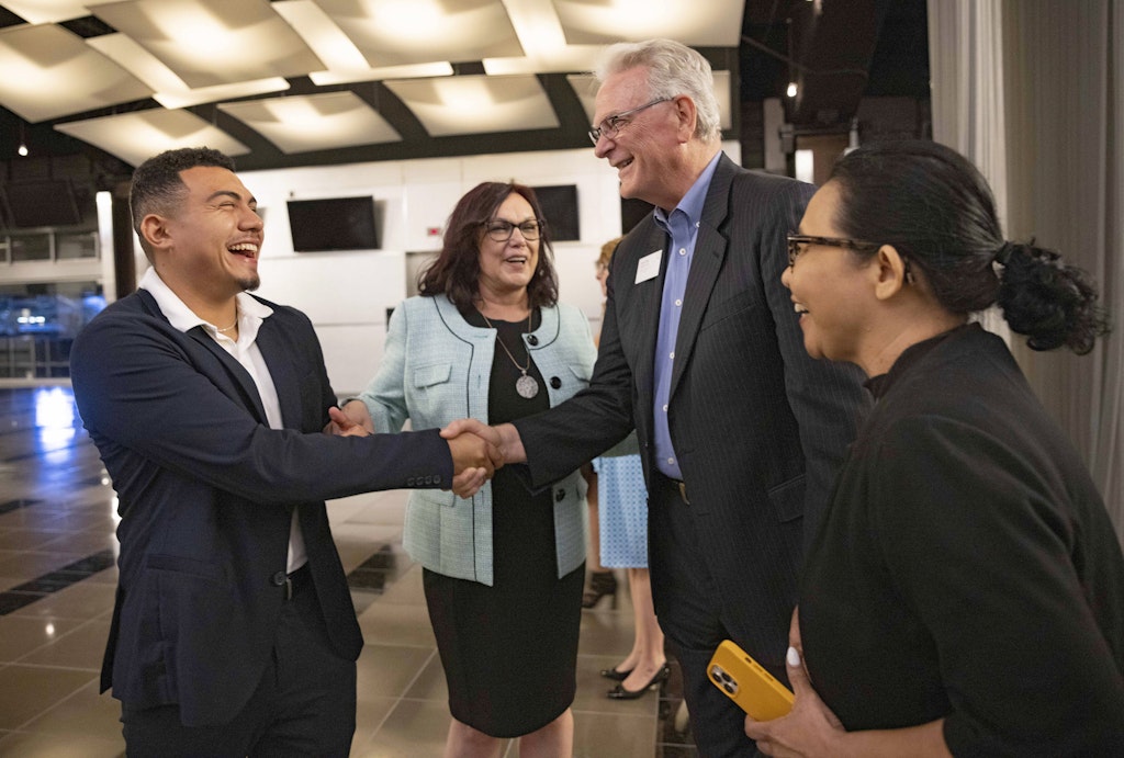 Agent Fernando Aguilera (left) shook hands with Jim Fite, president and ...