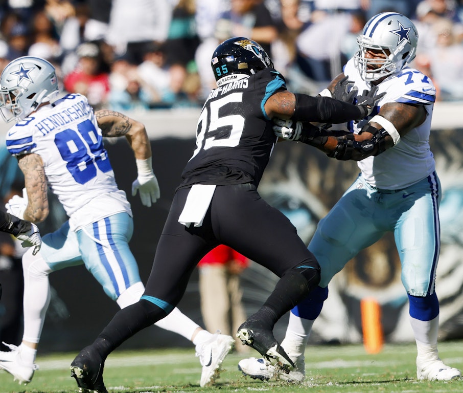 Tyron Smith (77) said the adjustment from left tackle to right tackle ...