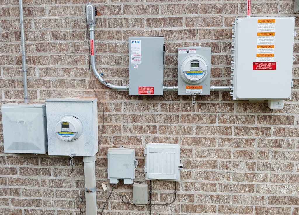electrical meters on the outside of tom seng s house allow him to pull ...