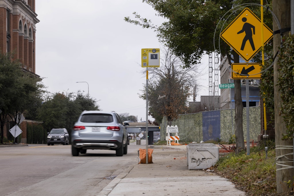 traffic flowed next to a closed sidewalk at the intersection of reagan ...